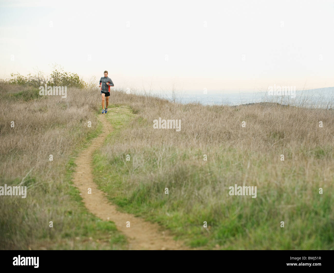 Person running on trail Stock Photo - Alamy