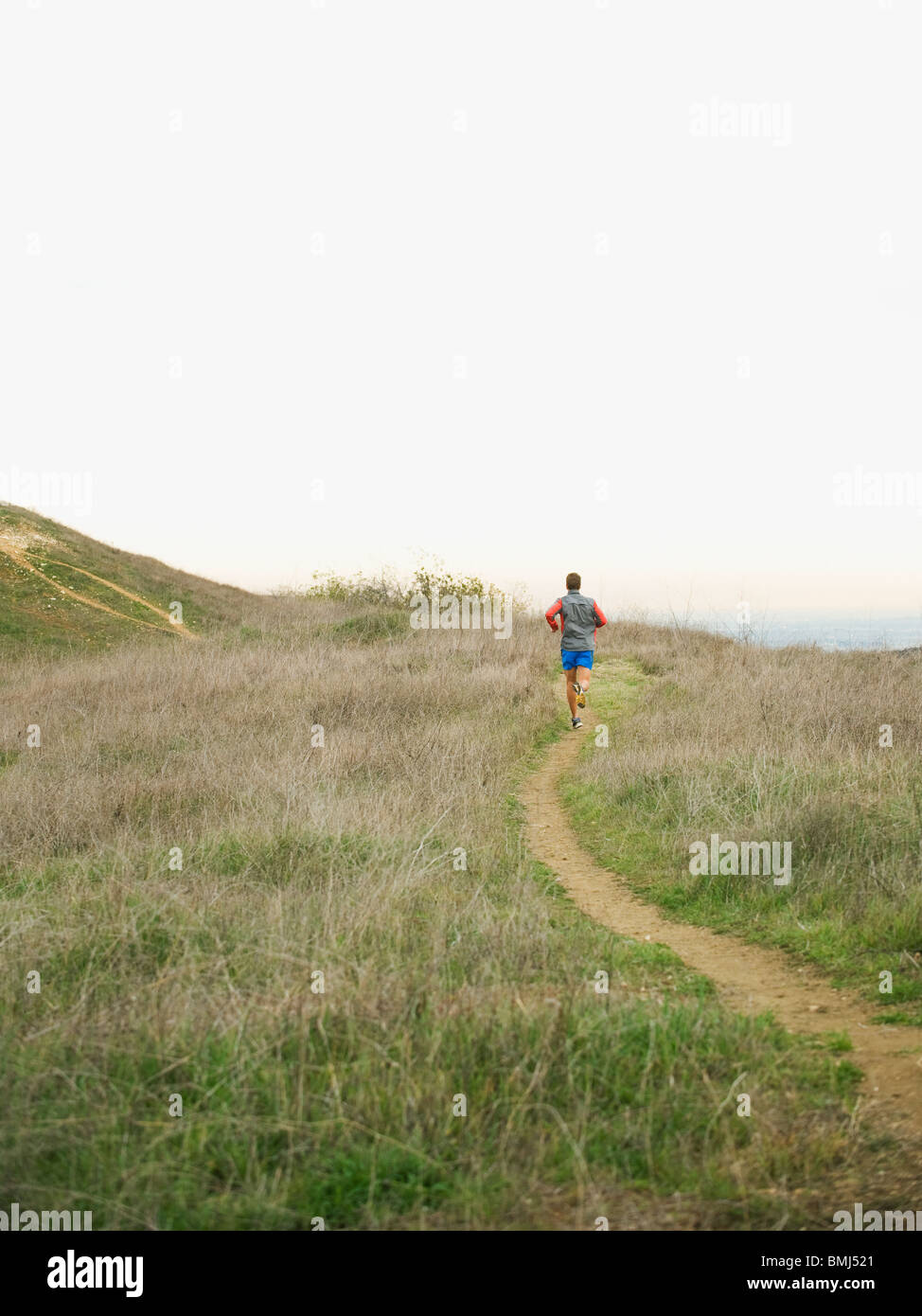 Male person running behind hi-res stock photography and images - Alamy