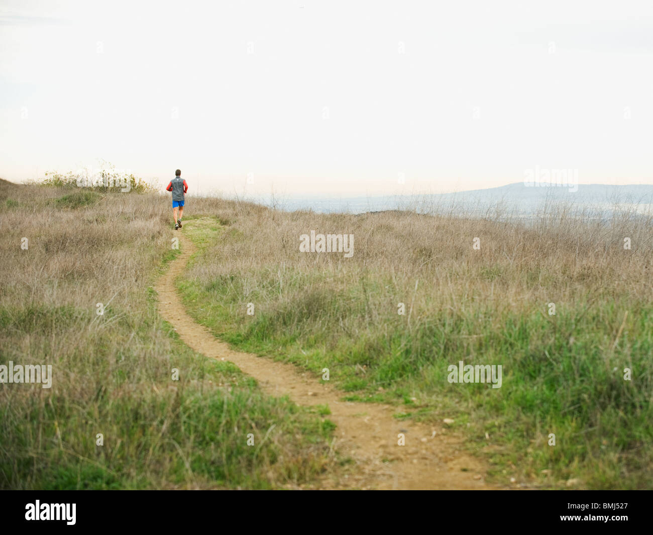 Person running on trail Stock Photo - Alamy
