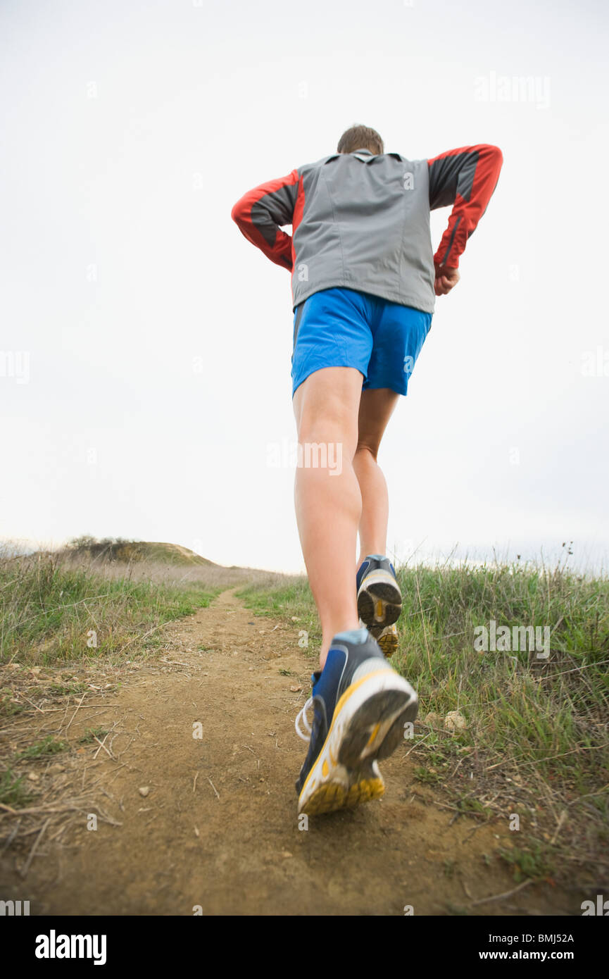 Person running on trail Stock Photo - Alamy