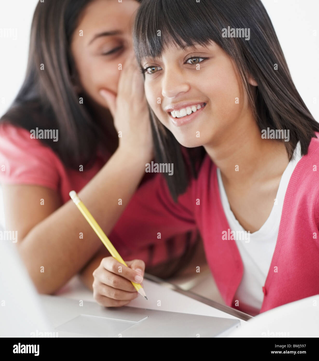 Students whispering classroom Stock Photo - Alamy