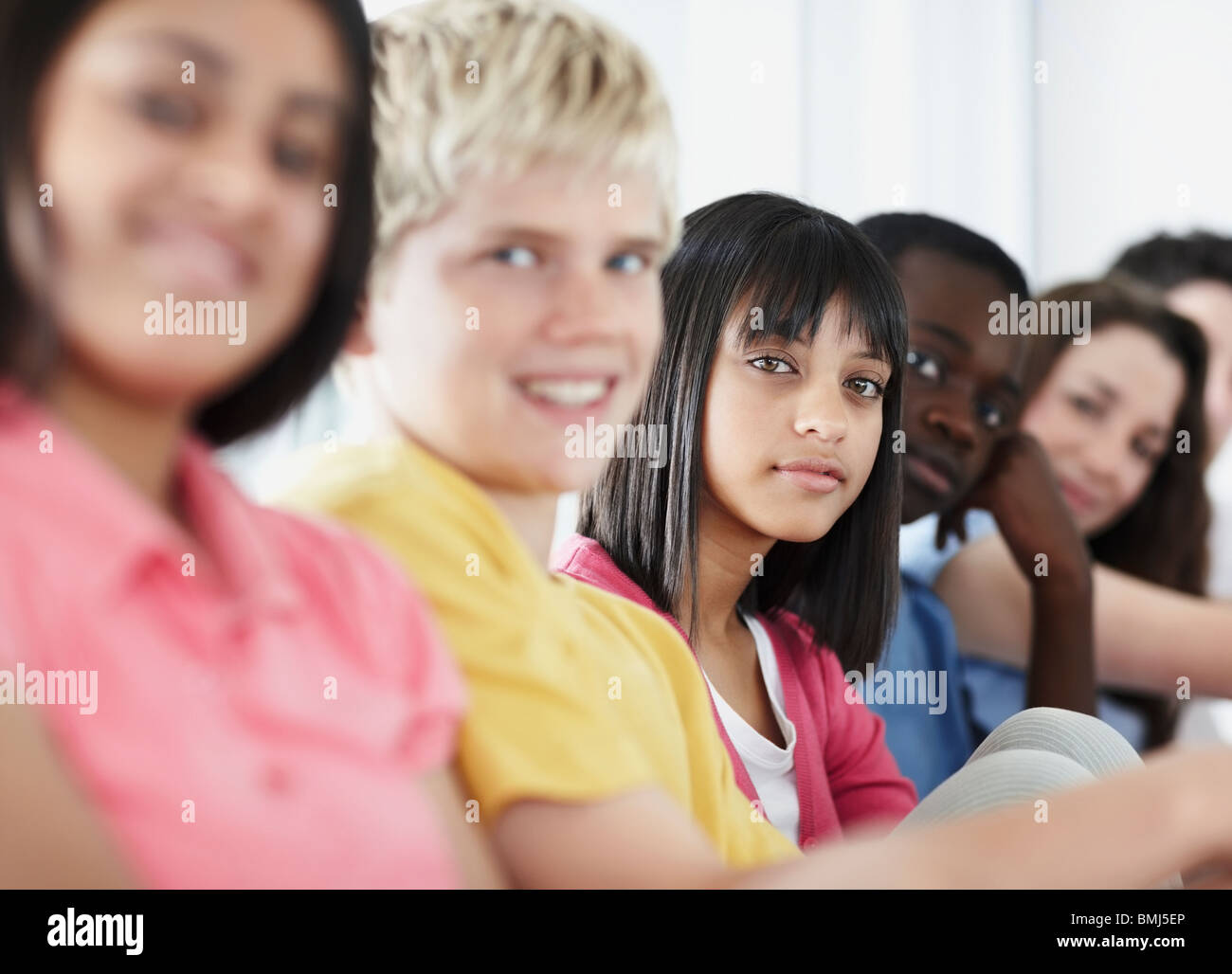 Students sitting in a row Stock Photo - Alamy