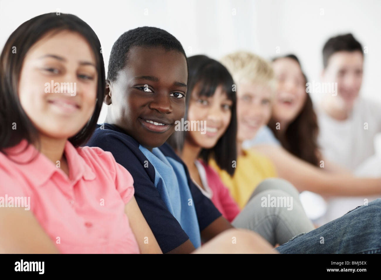 Students sitting in a row Stock Photo - Alamy