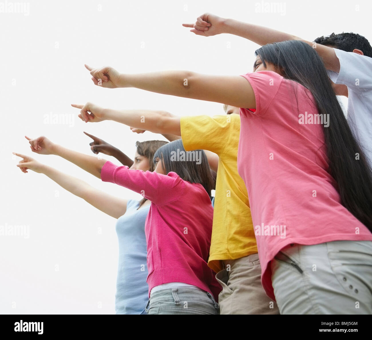 Group of friends pointing Stock Photo - Alamy