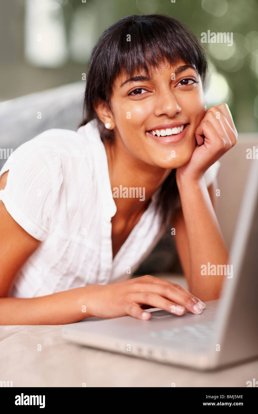 Young woman typing on laptop Stock Photo - Alamy