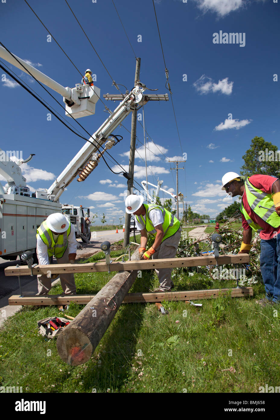 Electrical Workers Repair Power Line Damaged by Tornado Stock Photo - Alamy