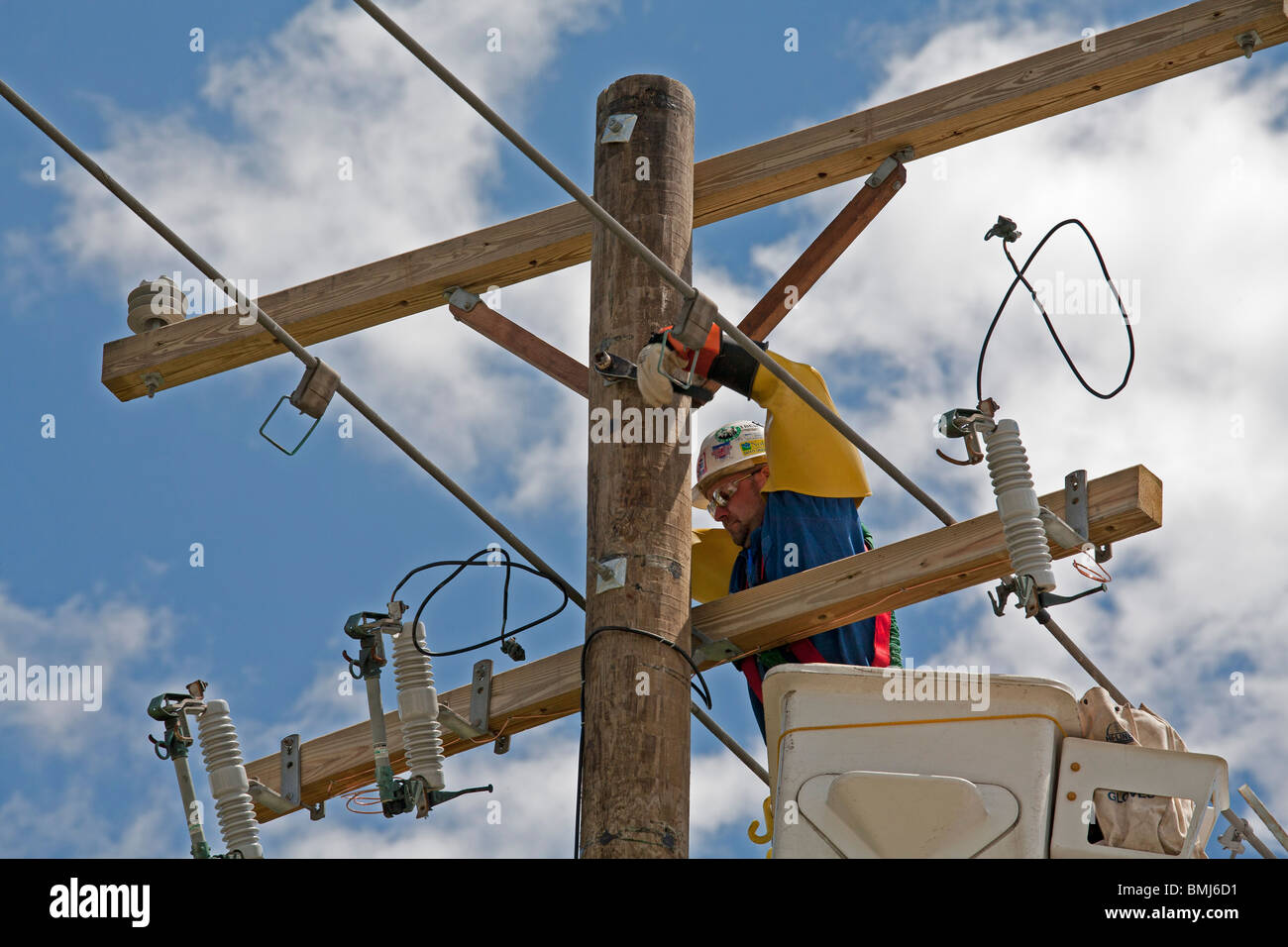 Electrical Workers Repair Power Line Damaged by Tornado Stock Photo - Alamy