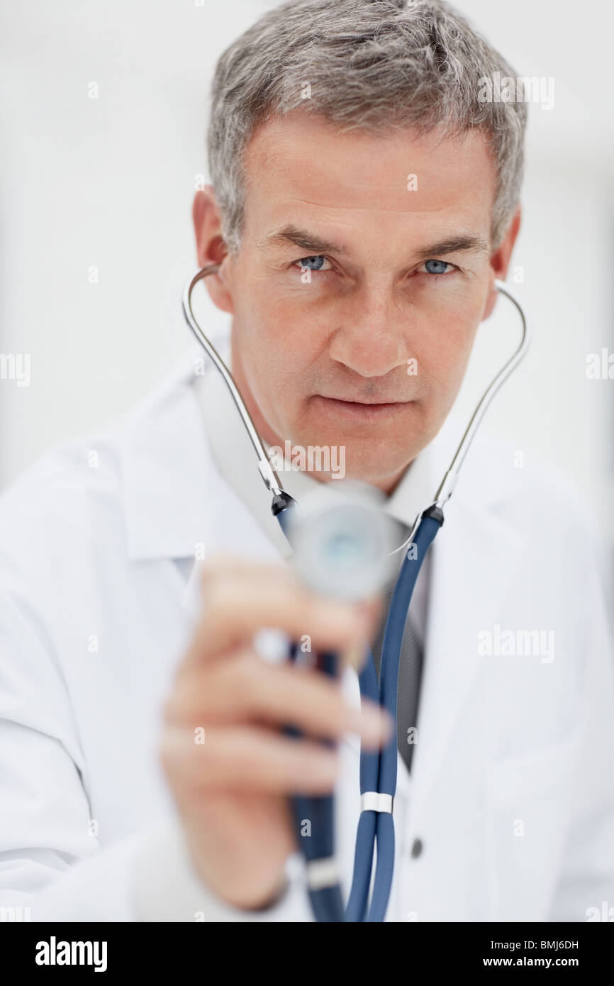 Doctor using stethoscope Stock Photo - Alamy