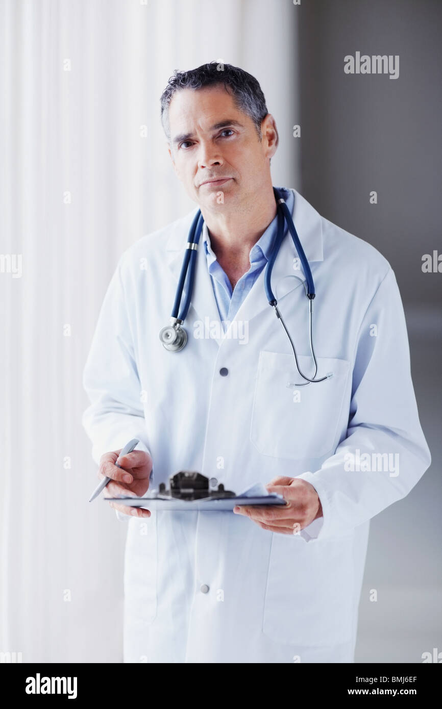Doctor holding chart Stock Photo - Alamy