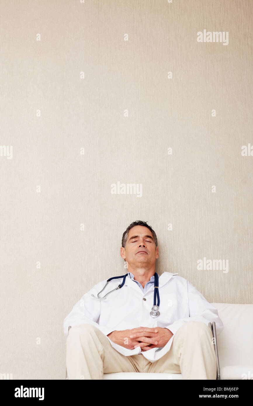 Doctor sitting in waiting room Stock Photo - Alamy
