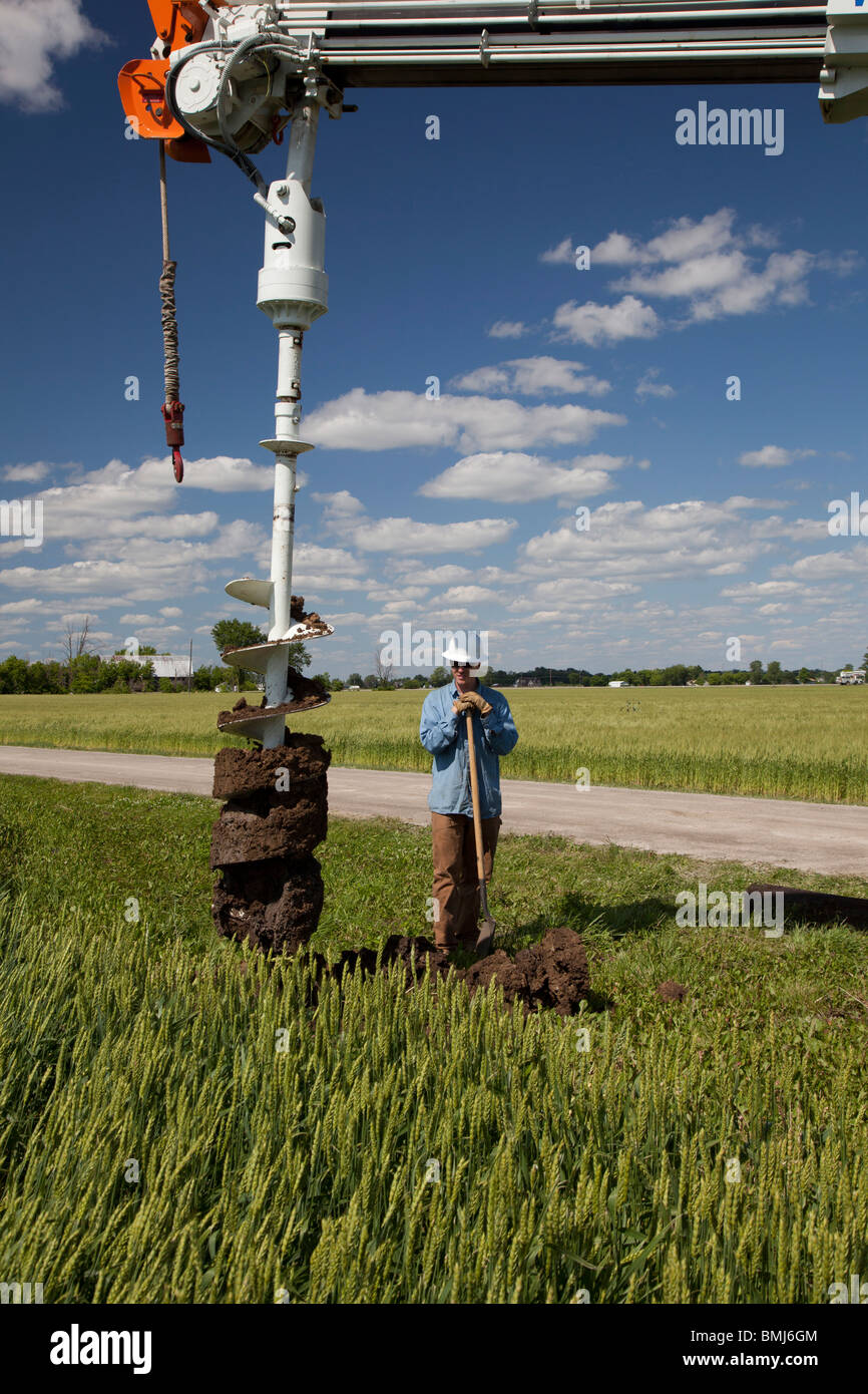 Electrical Workers Repair Power Line Damaged by Tornado Stock Photo - Alamy