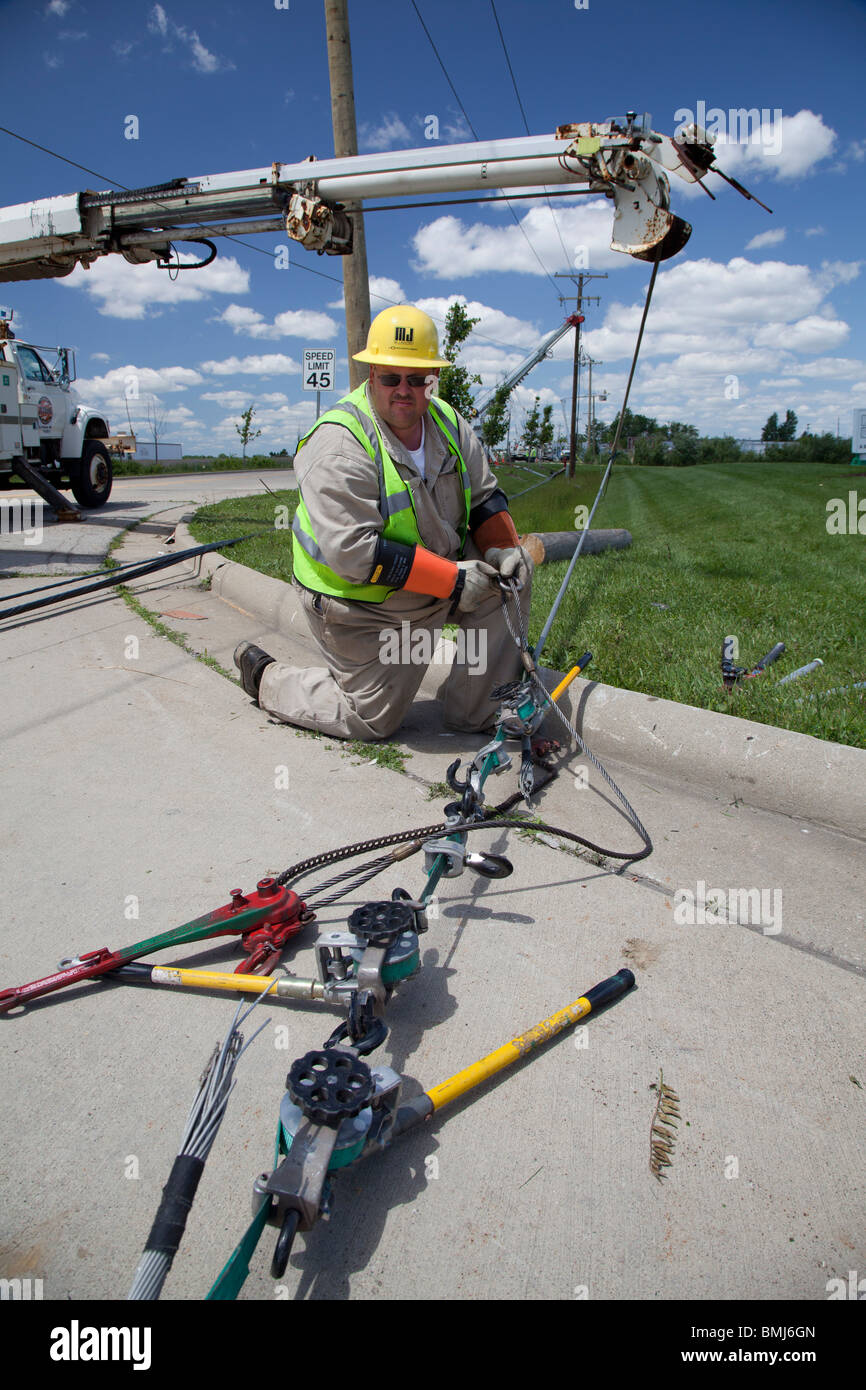 Electrical Workers Repair Power Line Damaged by Tornado Stock Photo - Alamy
