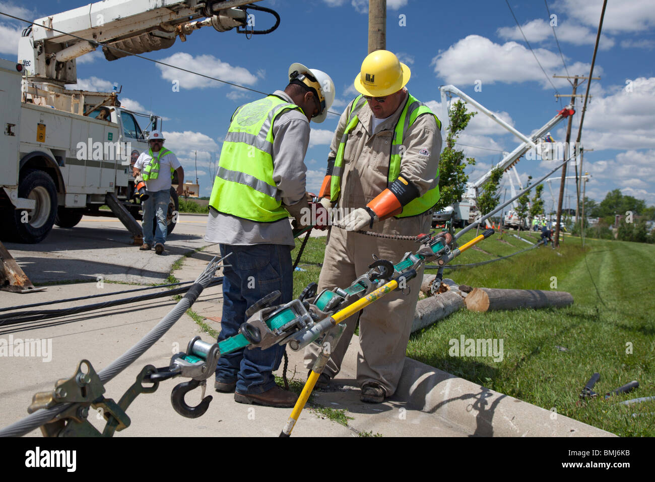 Electrical Workers Repair Power Line Damaged by Tornado Stock Photo - Alamy