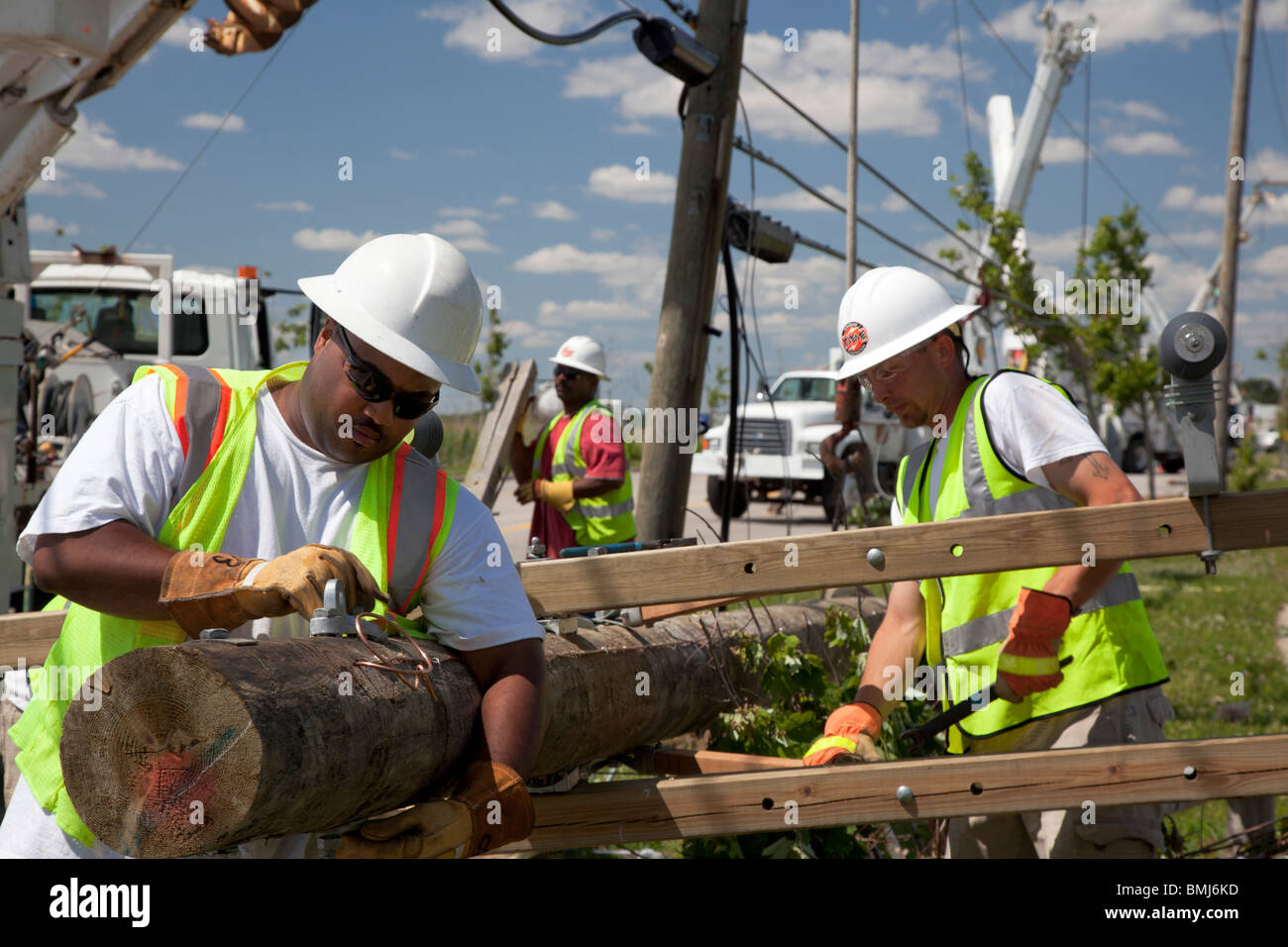 Electrical Workers Repair Power Line Damaged by Tornado Stock Photo - Alamy