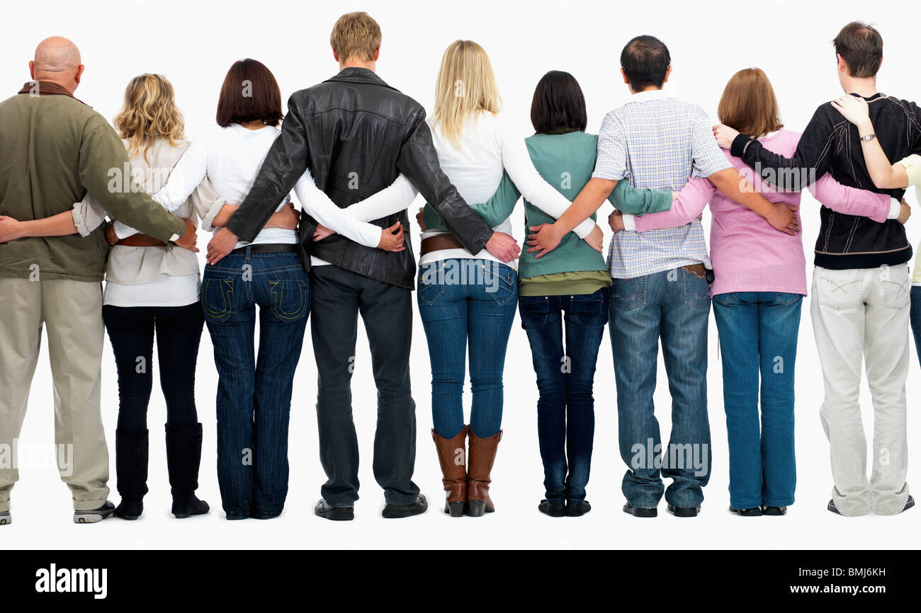 group of people with their arms around each other's backs Stock Photo ...