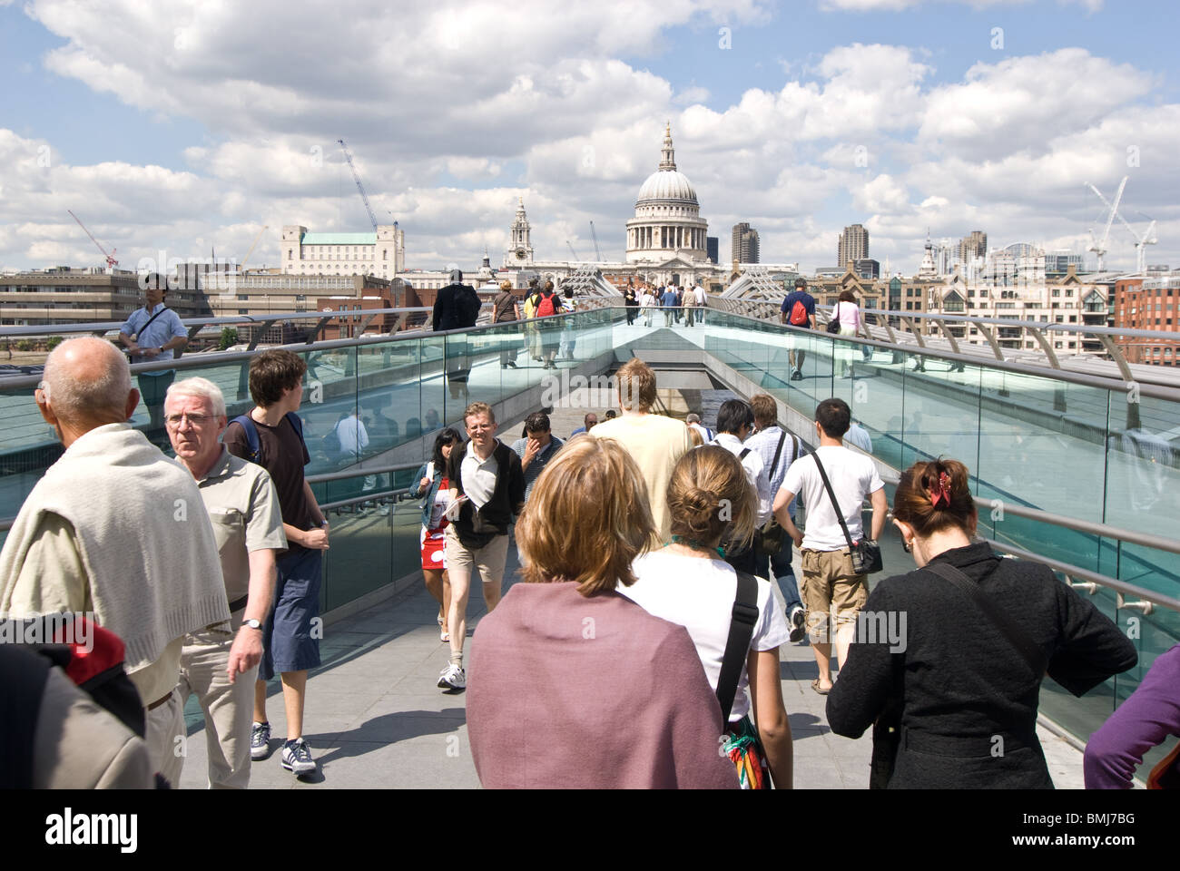 Millennium Bridge London with People on a sunny day with St Pauls Stock ...