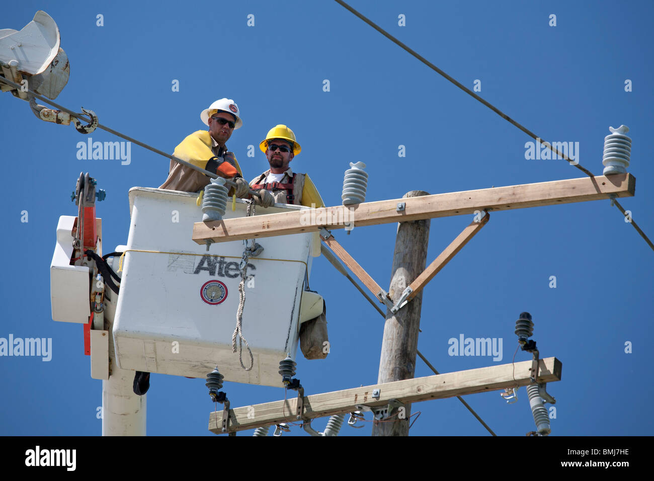 Electrical Workers Repair Power Line Damaged by Tornado Stock Photo - Alamy
