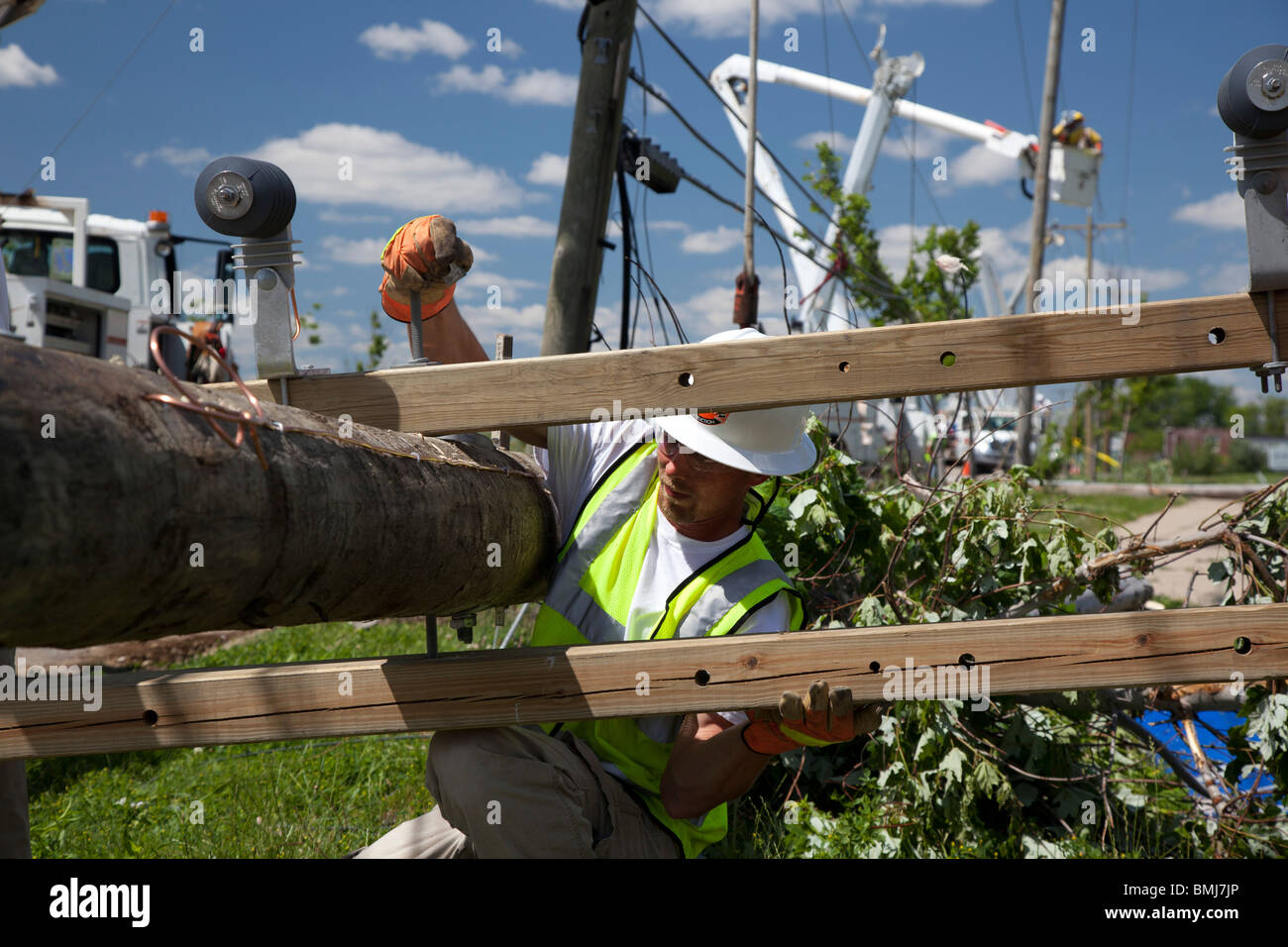 Electrical Workers Repair Power Line Damaged by Tornado Stock Photo - Alamy