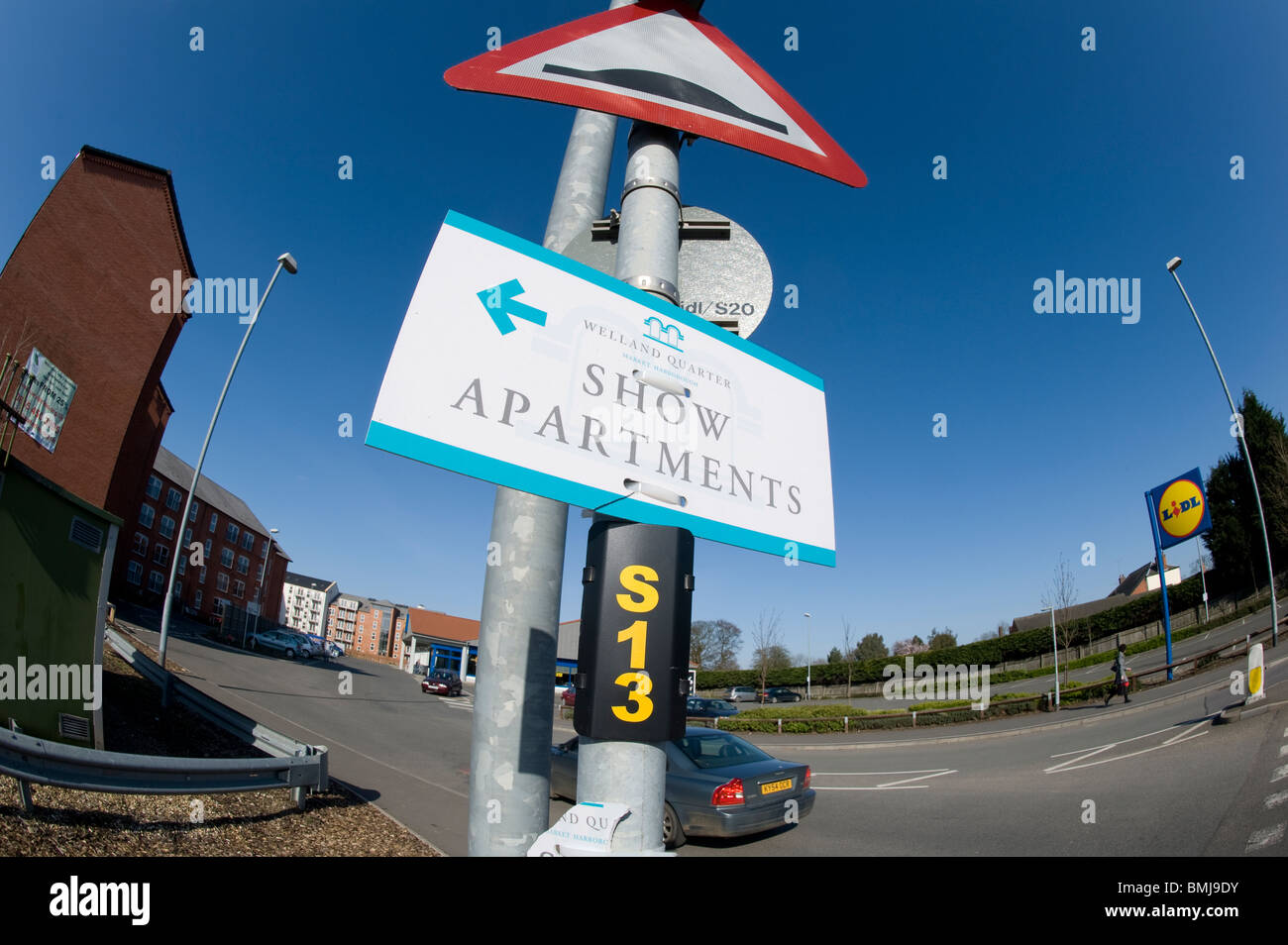 Sign pointing to show apartments in a town in England Stock Photo - Alamy