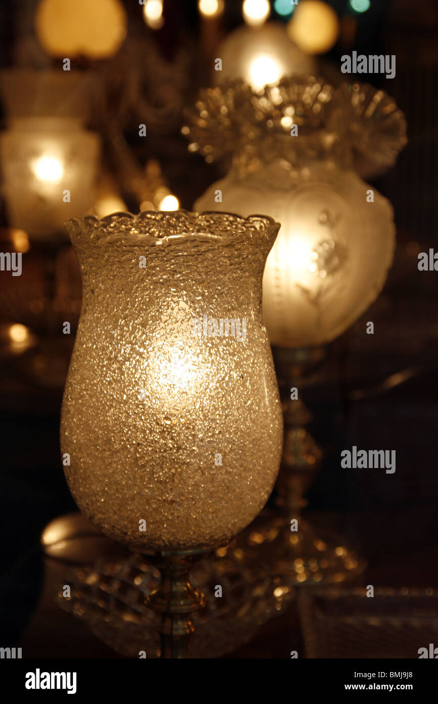 glass table lampshades in shop window at night Stock Photo - Alamy