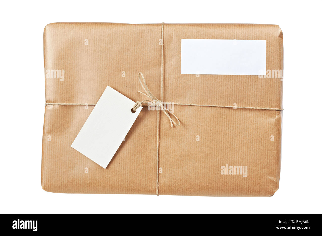 A parcel wrapped in brown paper and tied with rough twine and two blank ...