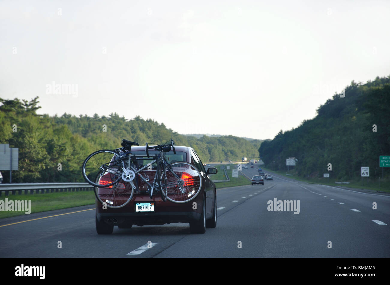 Car with bikes stacked on its back Stock Photo - Alamy
