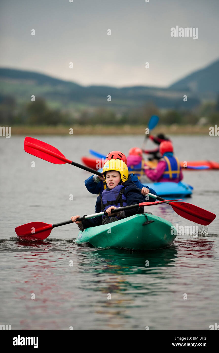 Children paddling kayaks at The Urdd outward bound activity Centre ...