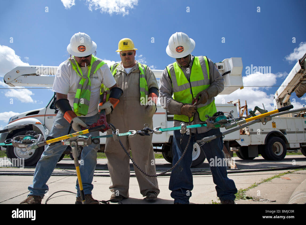 Electrical Workers Repair Power Line Damaged by Tornado Stock Photo - Alamy