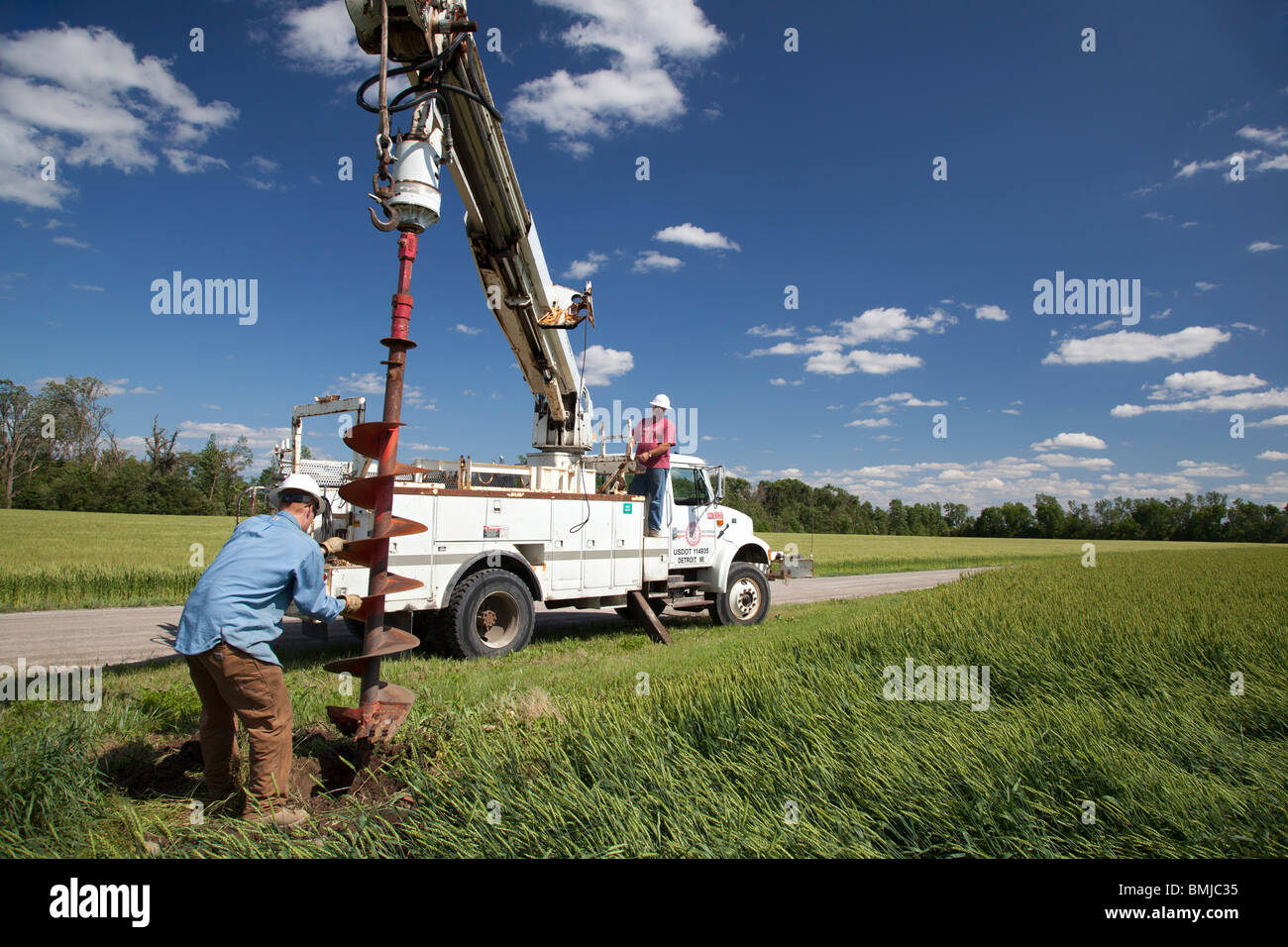 Electrical Workers Repair Power Line Damaged by Tornado Stock Photo - Alamy