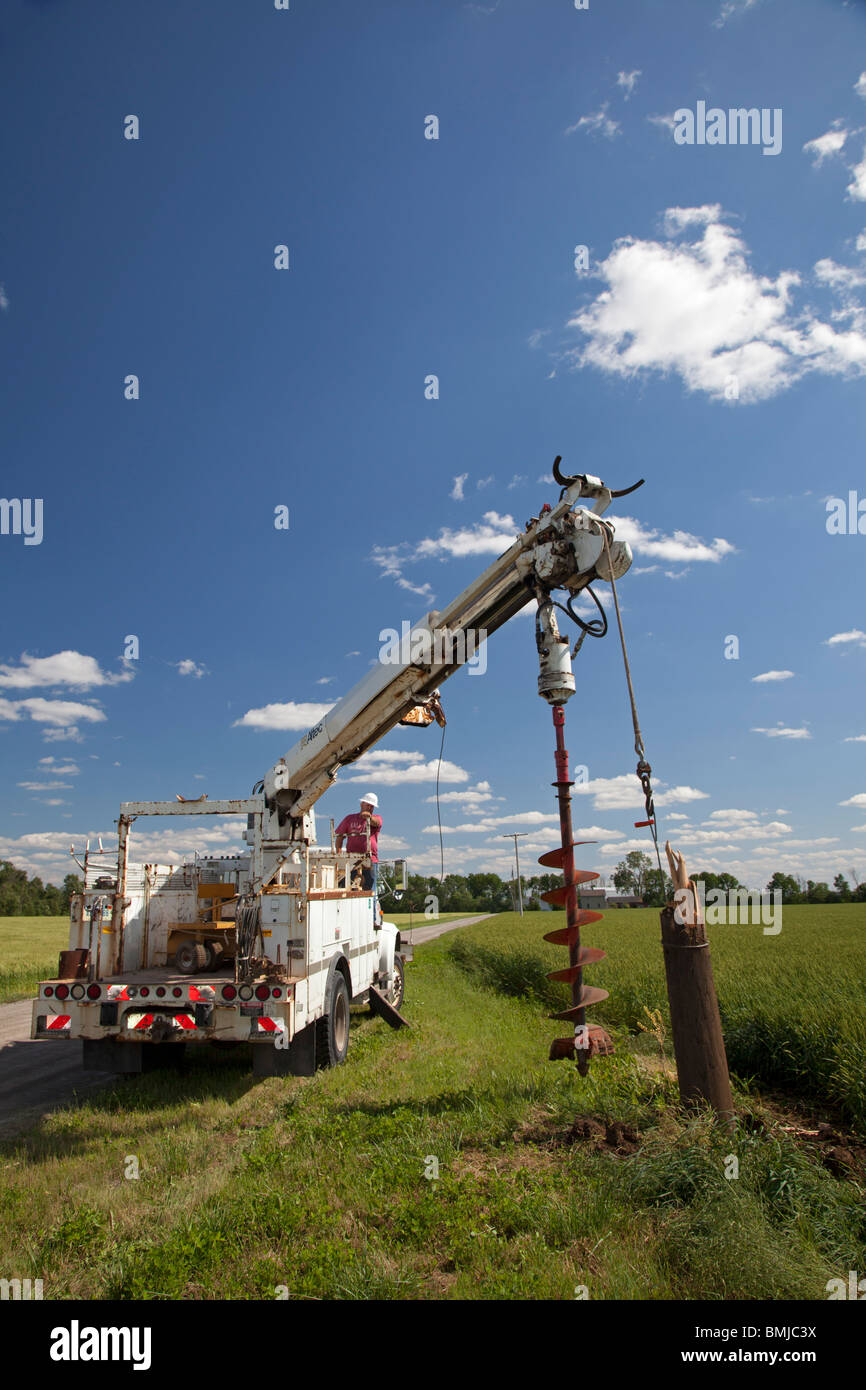 Electrical Workers Repair Power Line Damaged by Tornado Stock Photo - Alamy