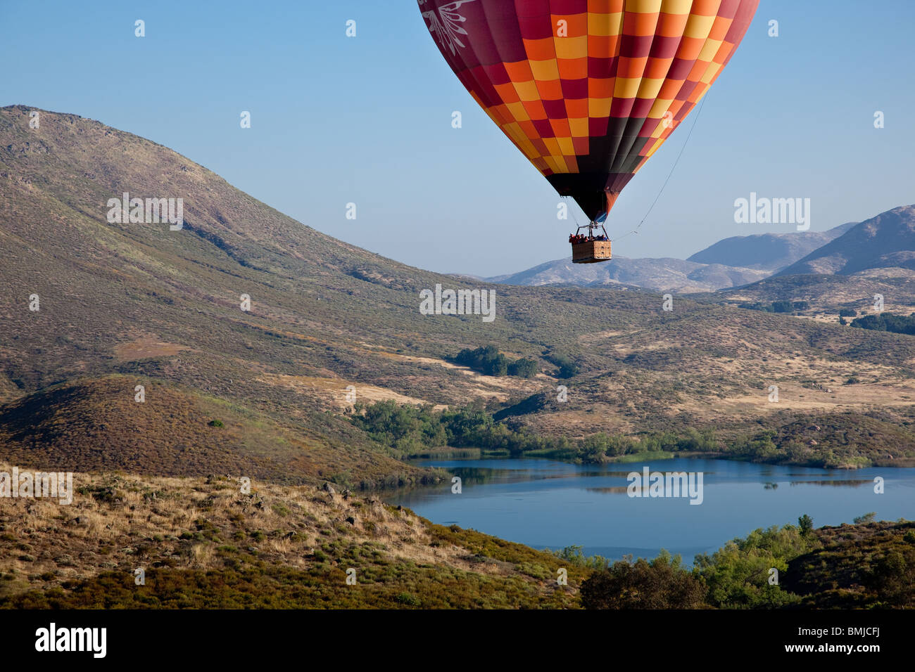 Hot air balloon by lake hi-res stock photography and images - Alamy