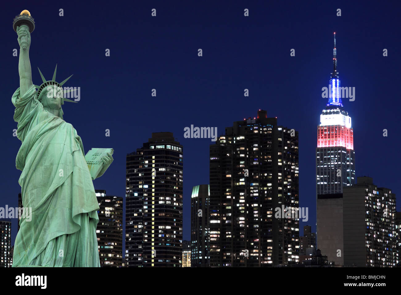 The Statue of Liberty and Manhattan skyline at sunset, New York City ...