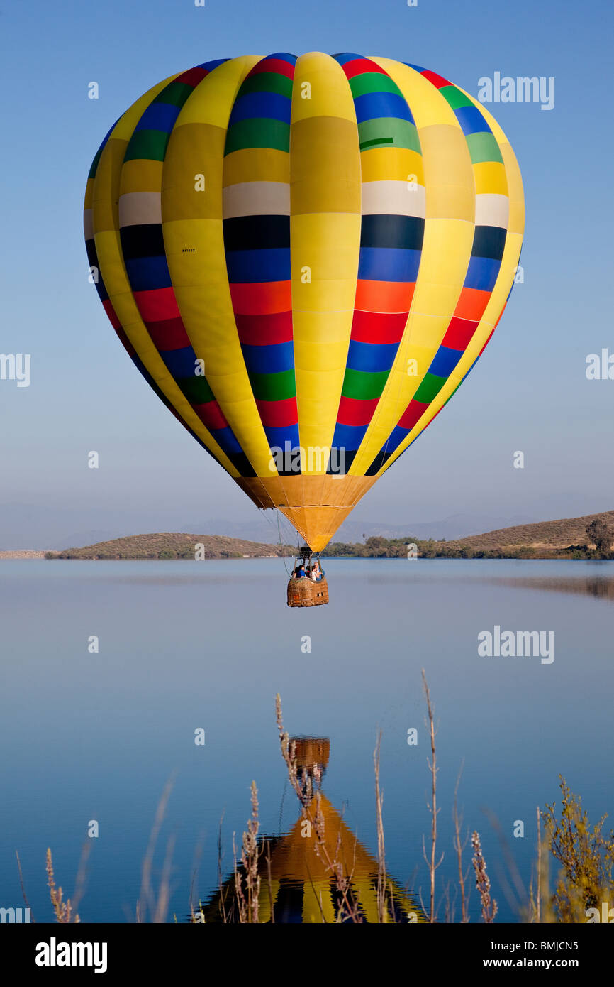 Hot Air Balloon over lake Stock Photo - Alamy