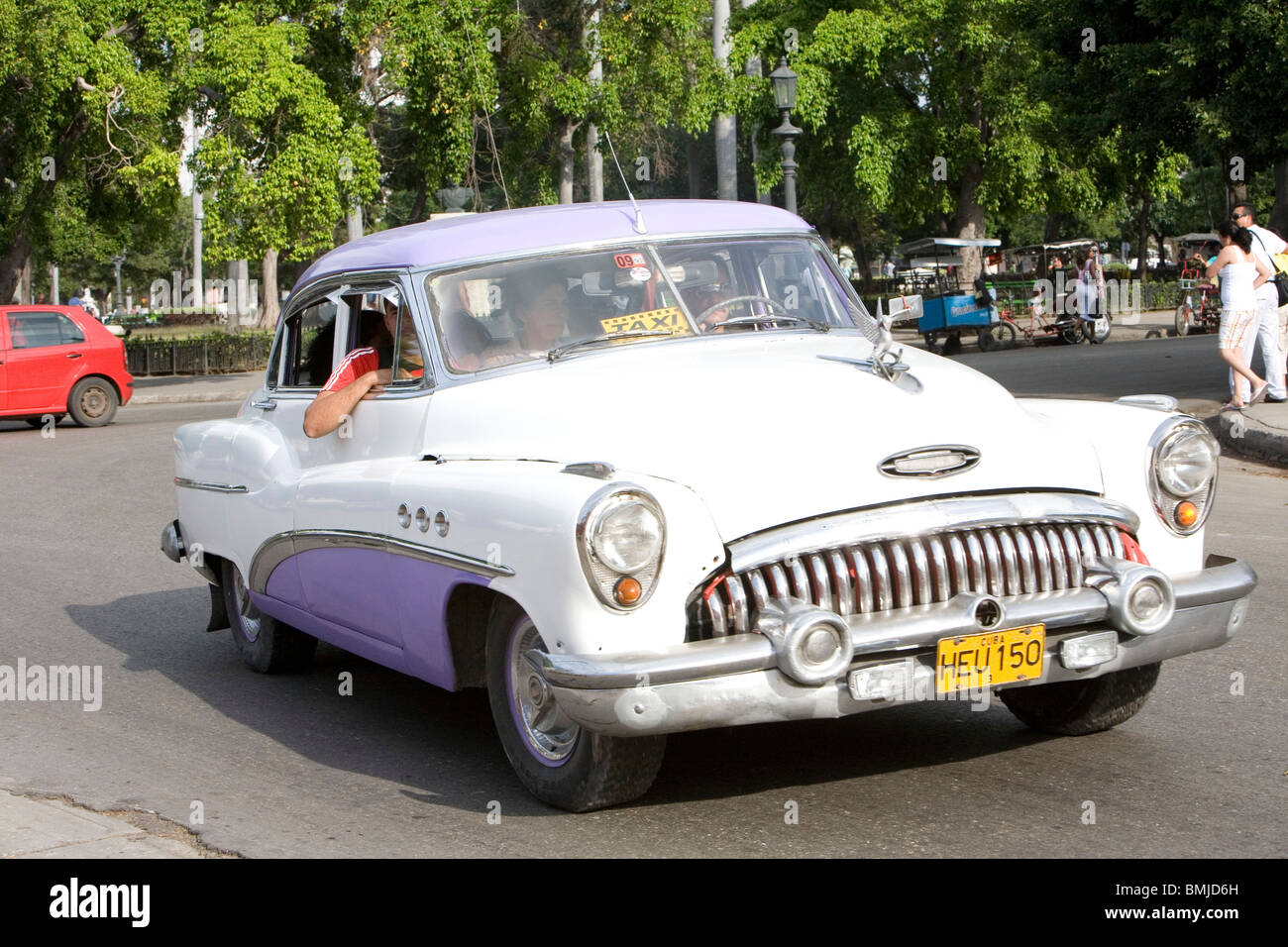 Classic American cars drive the streets of Havana, Cuba Stock Photo - Alamy