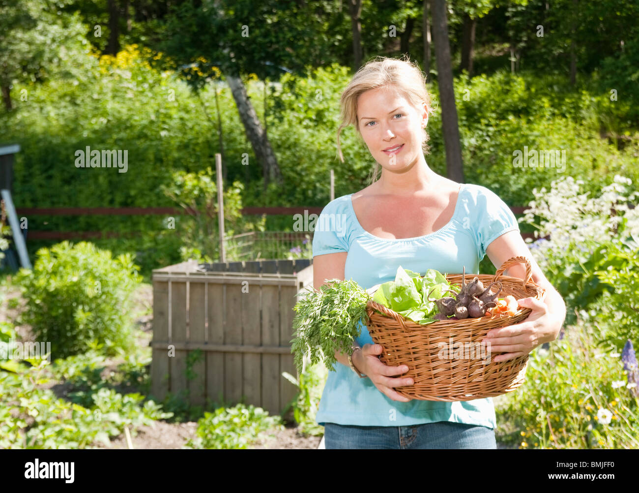 Woman in garden Stock Photo - Alamy