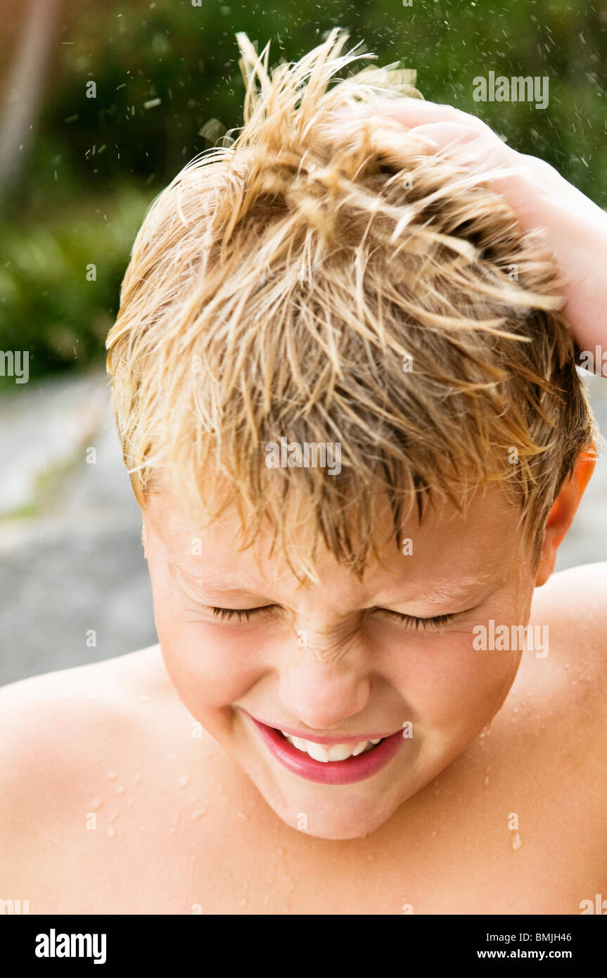 Boy scratching his head Stock Photo - Alamy