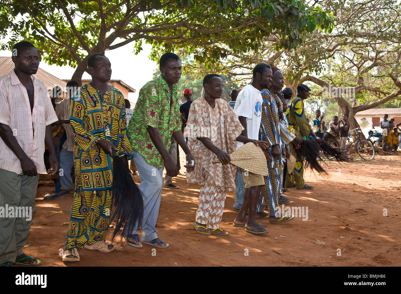 West Africa, Benin. Men dancing in line before Gelede Mask Dance Stock ...