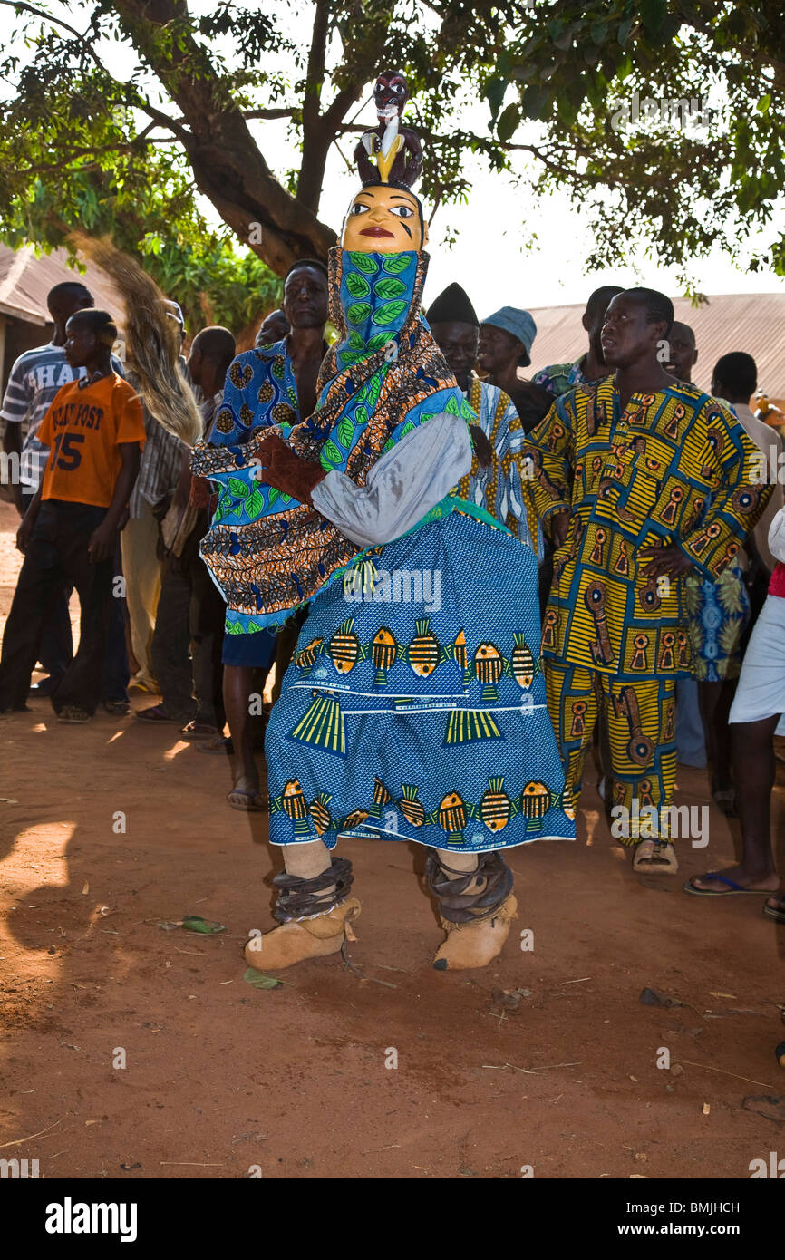 West Africa, Benin. Men watch Gelede Mask Dancers perform Stock Photo ...