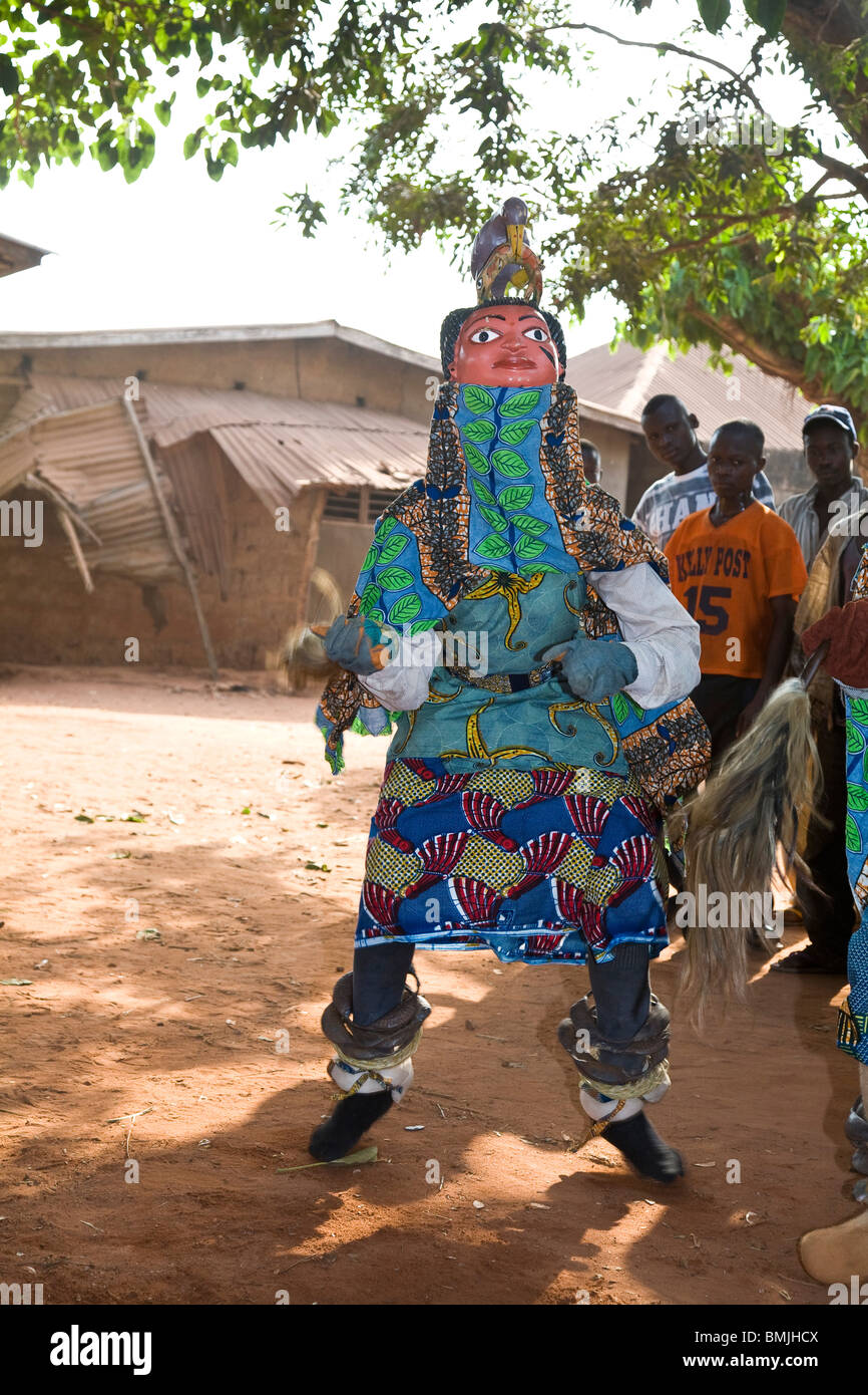 West Africa, Benin. Men watch Gelede Mask Dancers perform Stock Photo ...