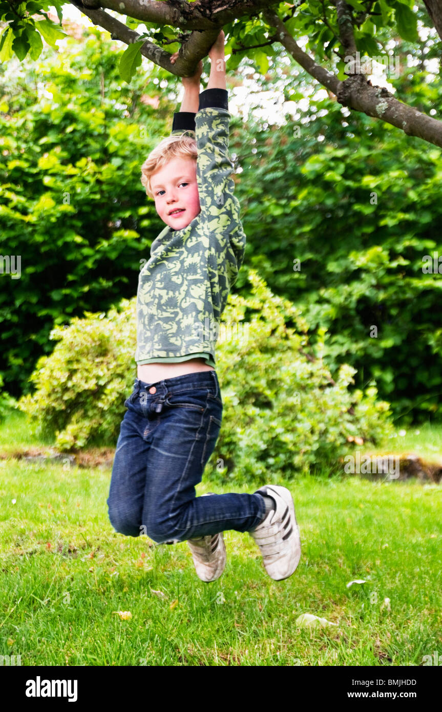 Boy playing outside Stock Photo - Alamy