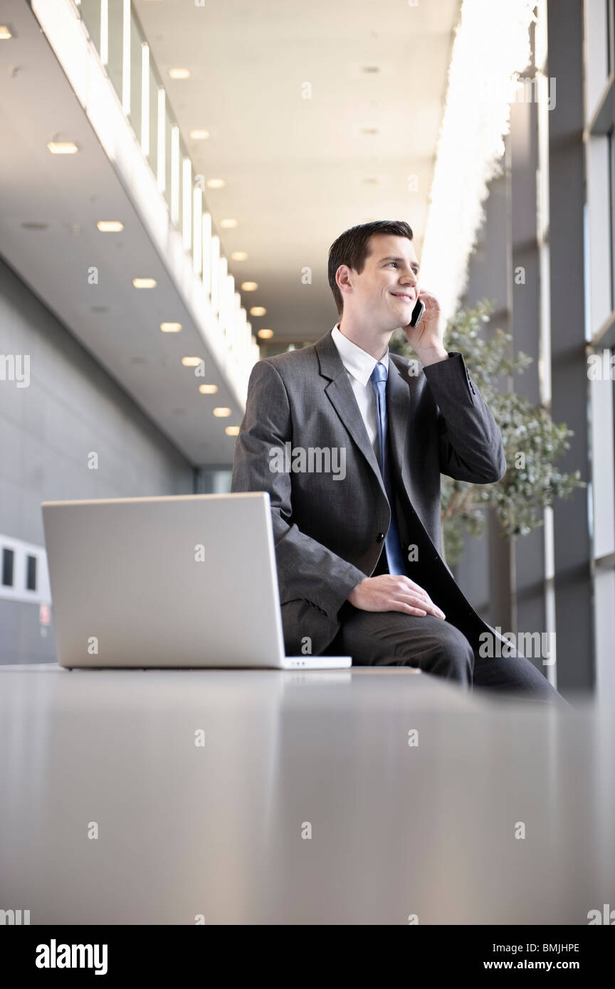 Businessman using cell phone Stock Photo - Alamy