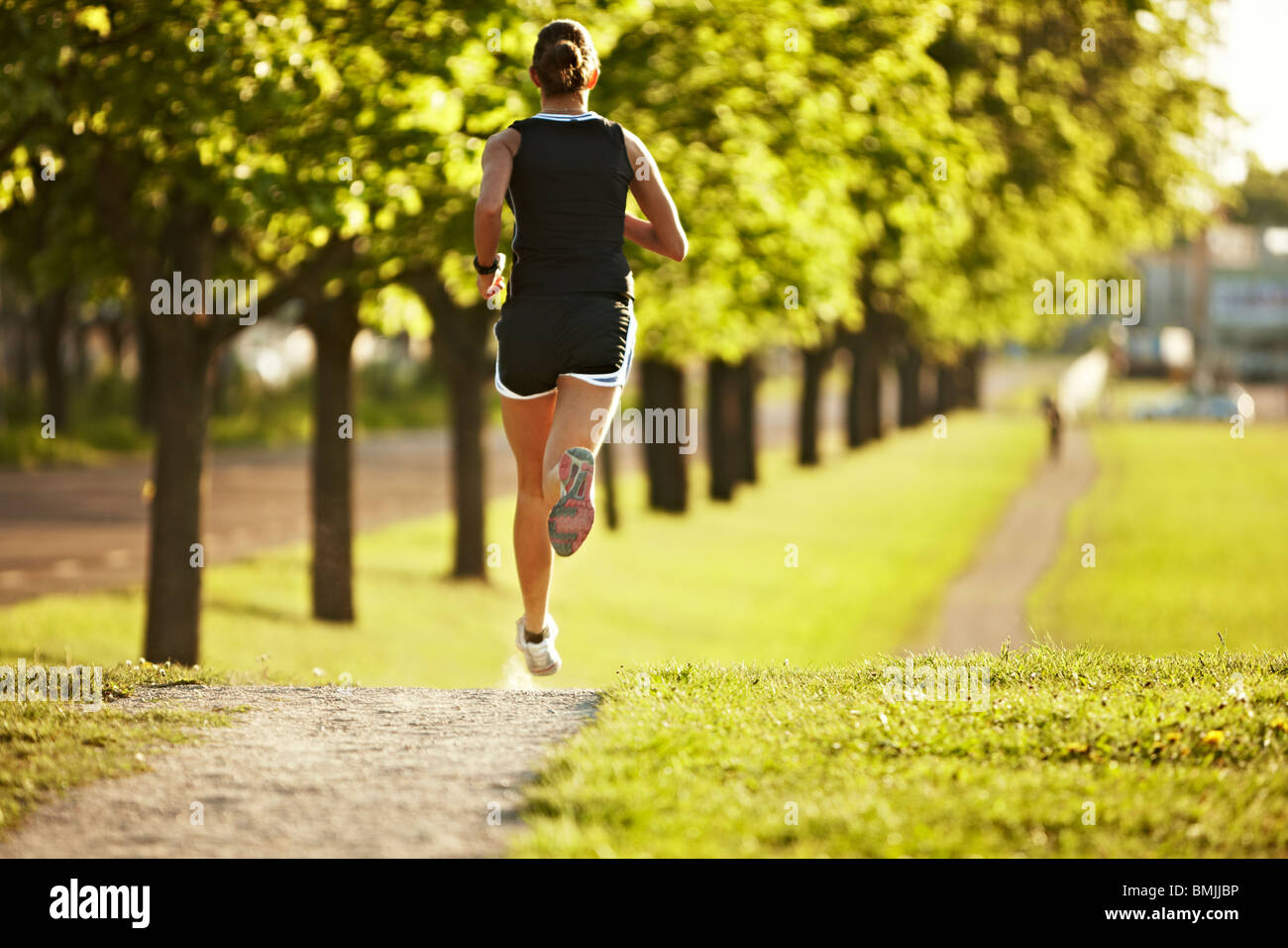 Young woman running, Sweden Stock Photo - Alamy