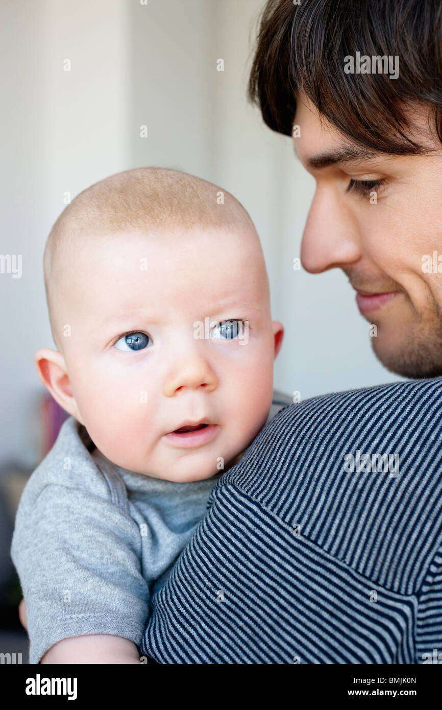Man holding baby Stock Photo - Alamy
