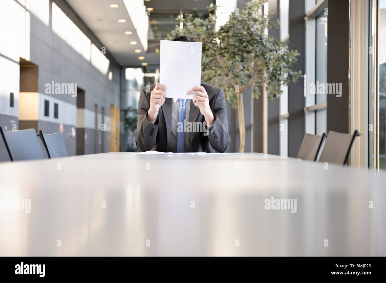 Man holding object in front of face hi-res stock photography and images ...