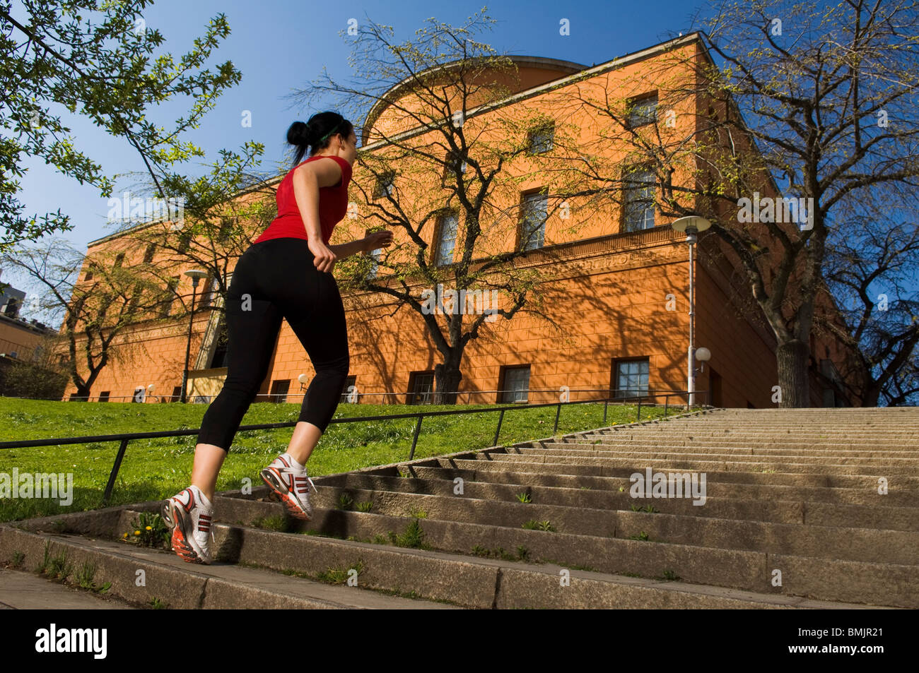 Woman stepping up rear view hi-res stock photography and images - Alamy