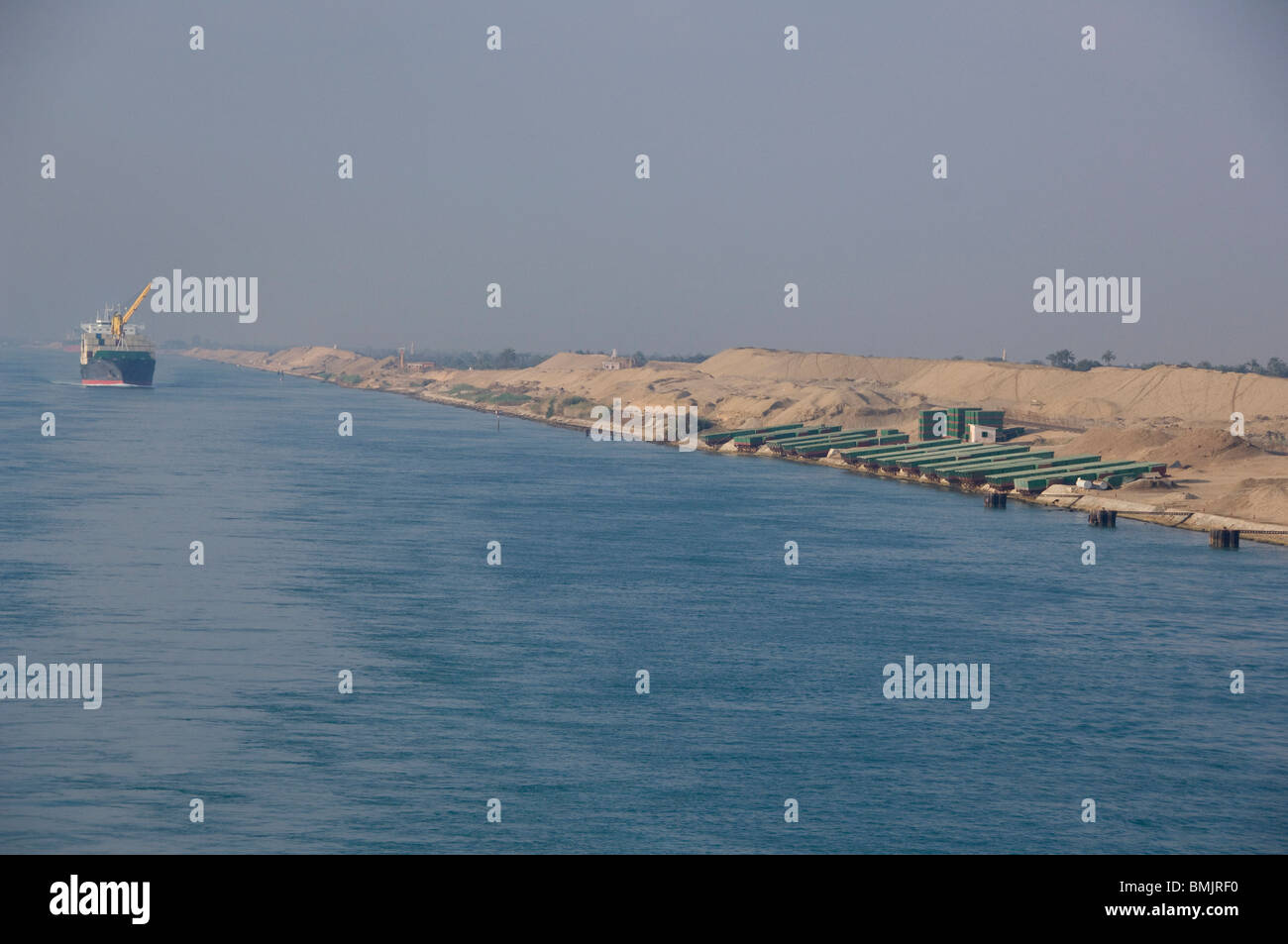 Egypt, Suez Canal. Typical canal views, ship transiting canal. Floating ...
