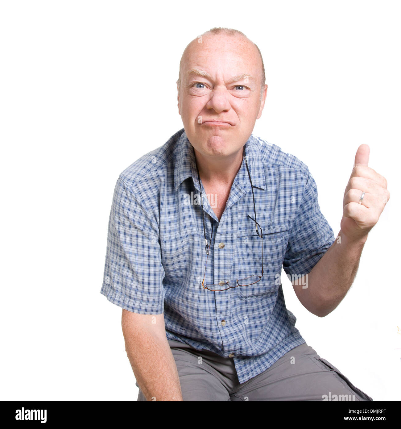 Expressive old man looking aggressive isolated against white background ...