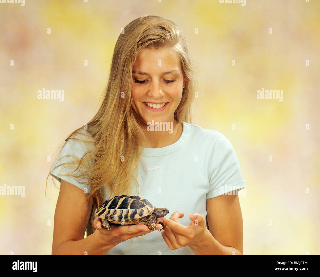 girl with a tortoise on her hand Stock Photo - Alamy