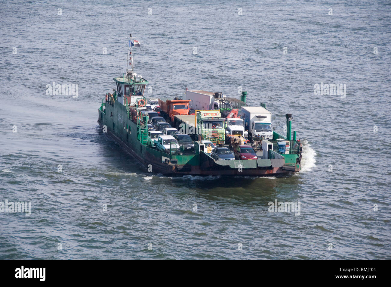 Egypt, Suez Canal. Typical auto ferry that takes passengers, and horse ...