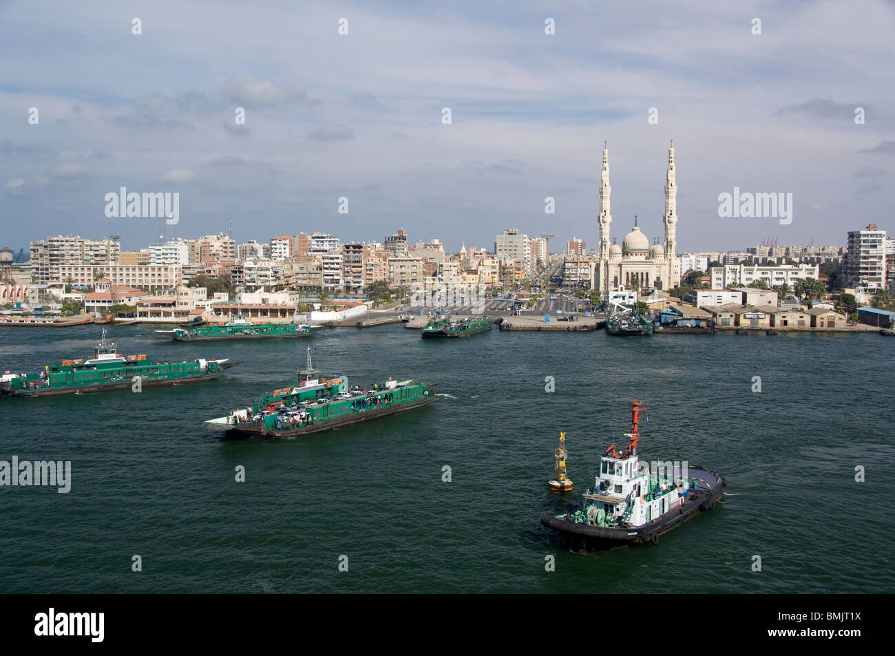 Egypt, Suez Canal. Typical canal views, auto ferry that takes ...